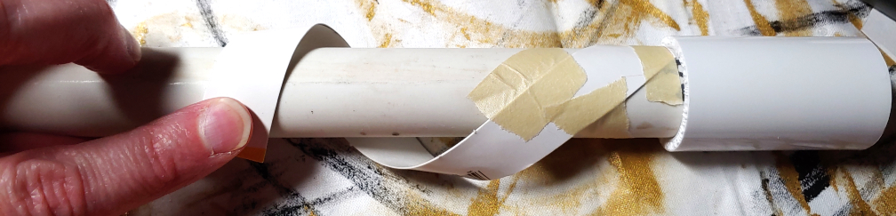 Creating a wrapped handle effect with paper mache and a PVC pipe ...
